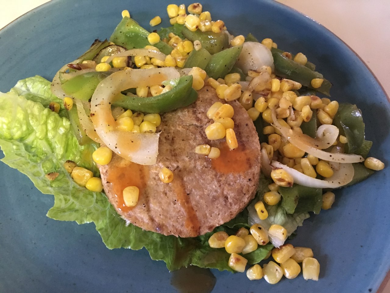Boca vegan patty, sautéed peppers, onions and corn on a bed of lettuce ...