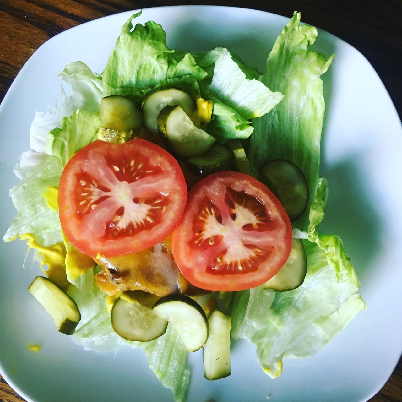 Lunch! A plate of lettuce with a turkey burger, cheddar 🧀 (had that ...