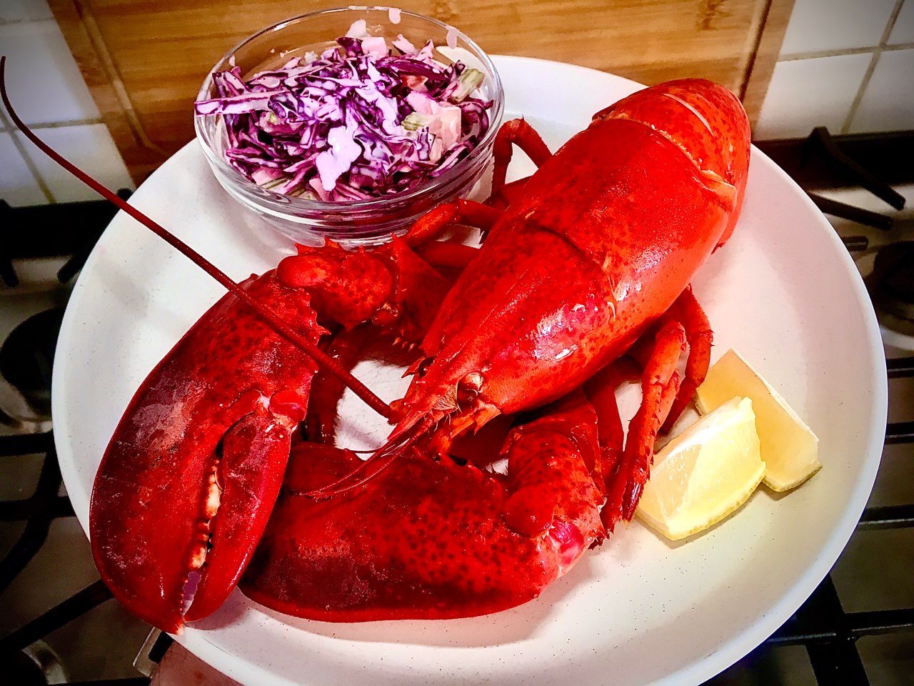 Cold lobster for lunch w. homemade coleslaw and a few lemon wedges ...