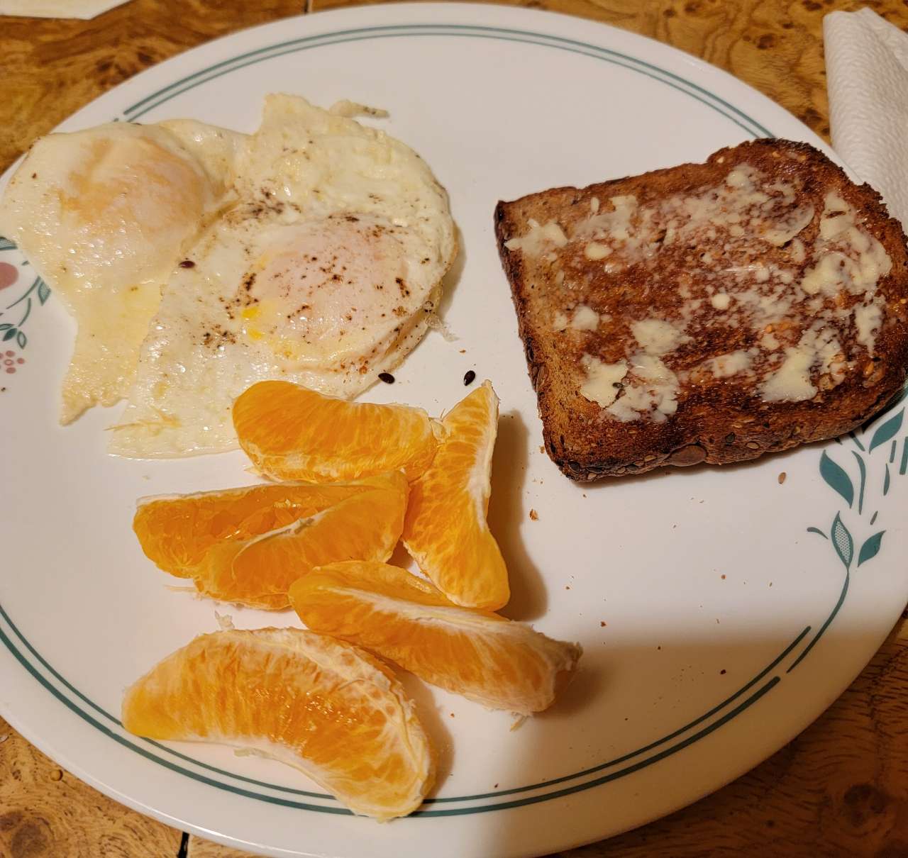 Two Eggs, a slice of Killer Dave's Bread, and half of a Sumo Mandarin ...
