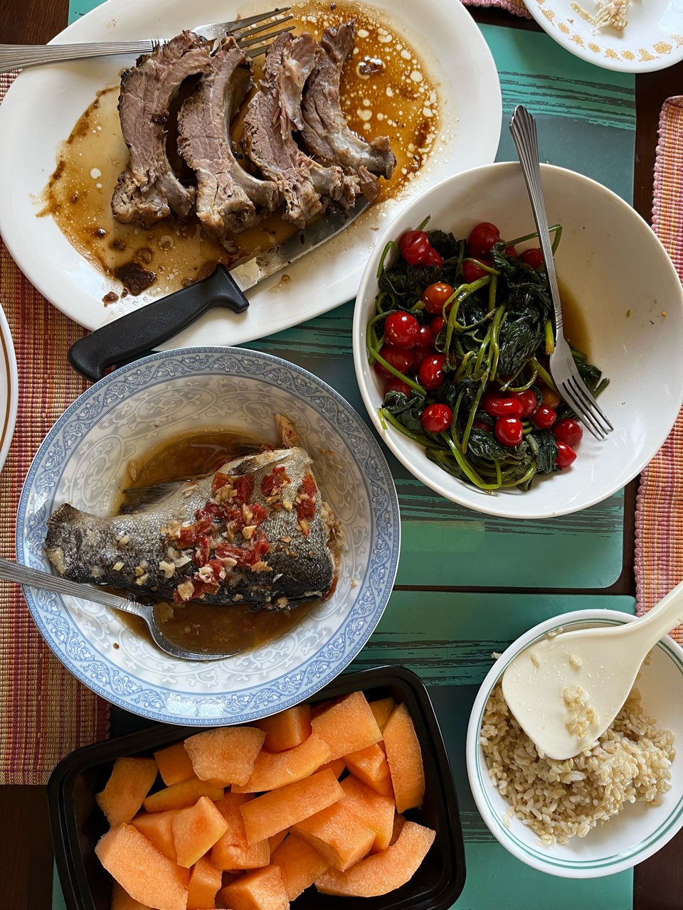 Fresh sweet potato leaves ( kamote) and cherry tomatoes in f ...